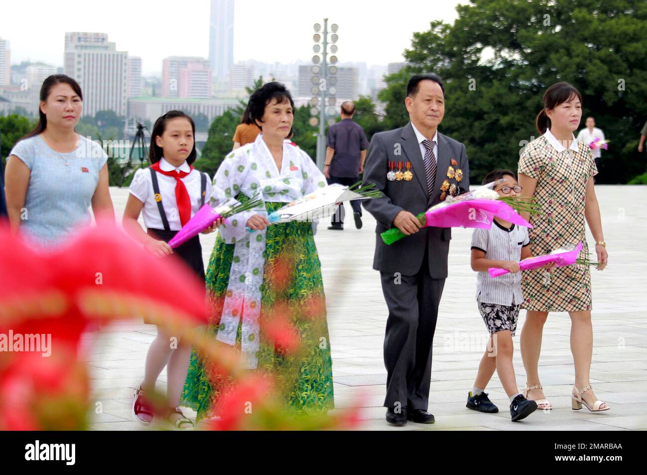 Pyongyang citizens visit the statues of their late leaders Kim Il Sung ...