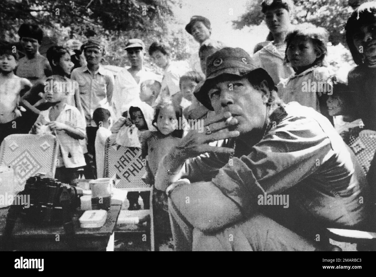 FILE - British photographer Tim Page is surrounded by Cambodian ...