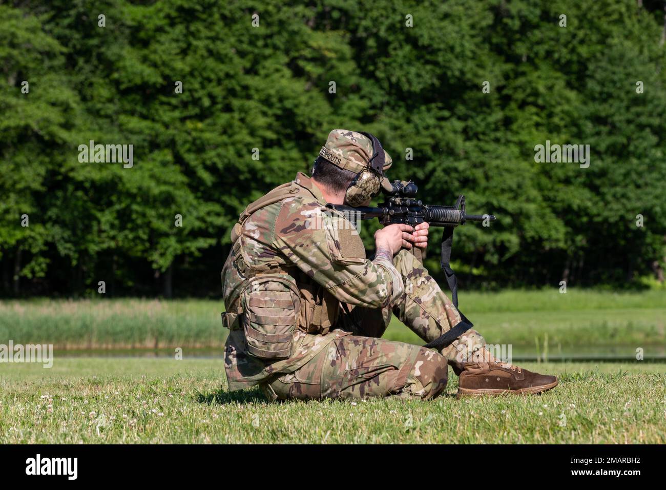 Spc. Christian Leenhouts, with the 2-101 CAV, aims his M4 Carbine rifle ...