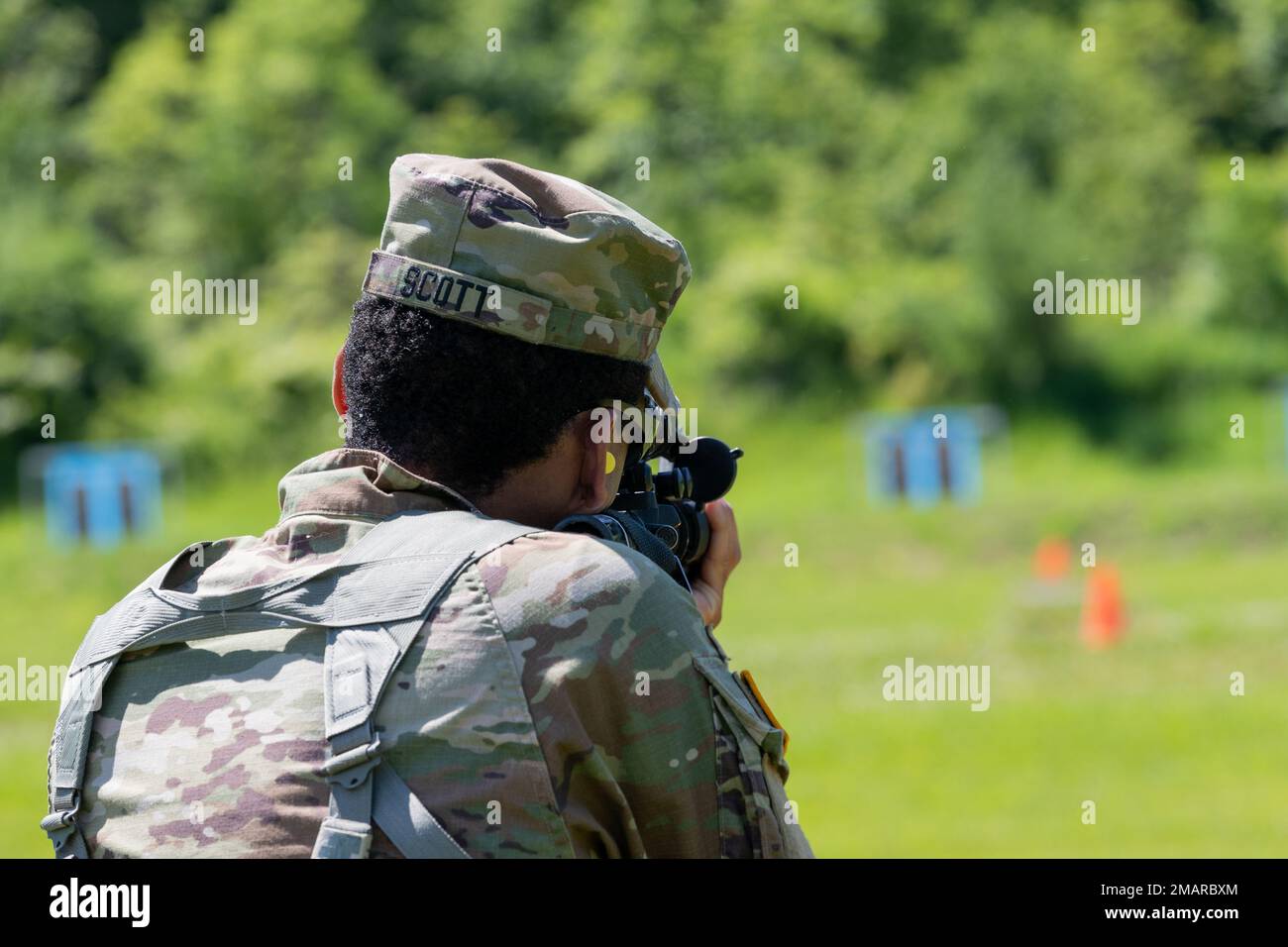 Staff Sgt. Sterling Scott, with the 369th Sustainment Brigade, aims his ...
