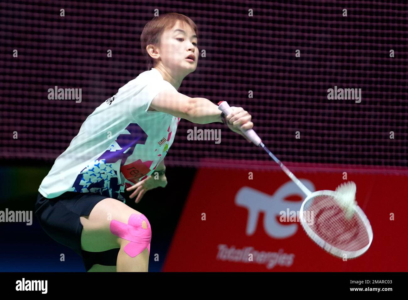 Vivian Hoo of Malaysia, with Lim Chiew Sien, plays a return during a ...