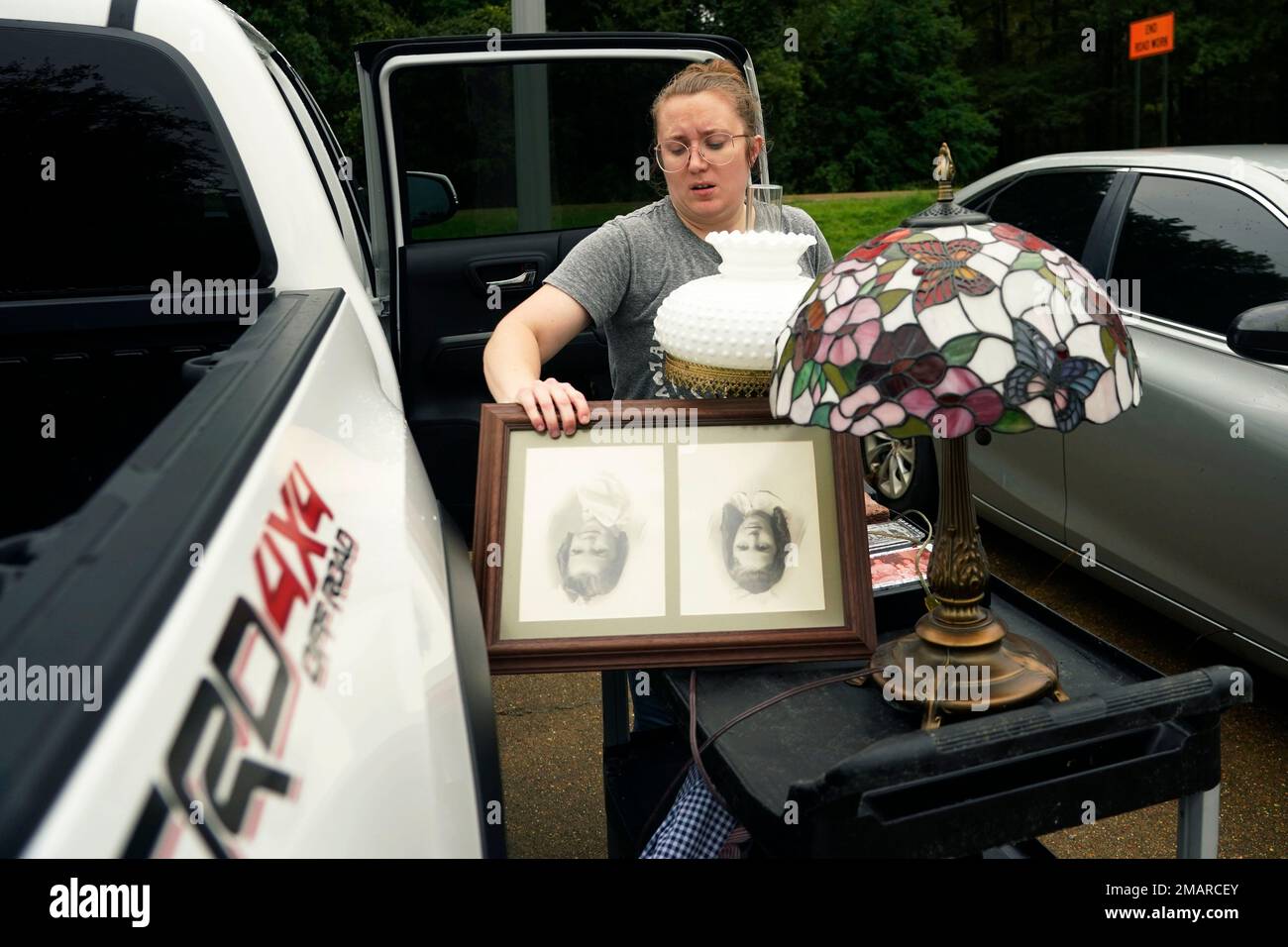 Courtney Ingle loads some of her grandmother's possessions into her ...