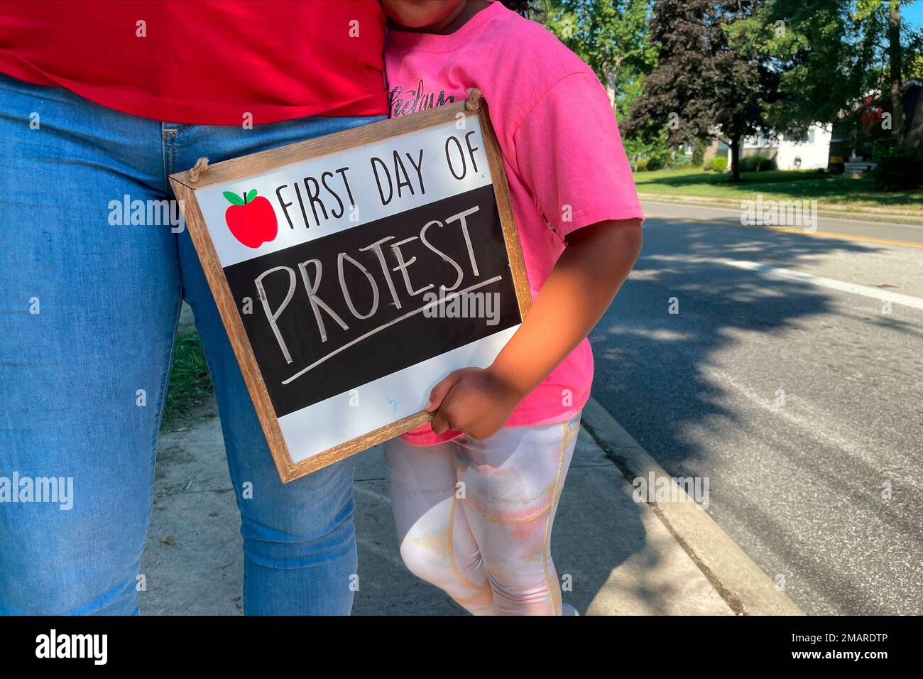 Amy Chapman and her daughter, first grader Corinne Anderson, pose for a ...