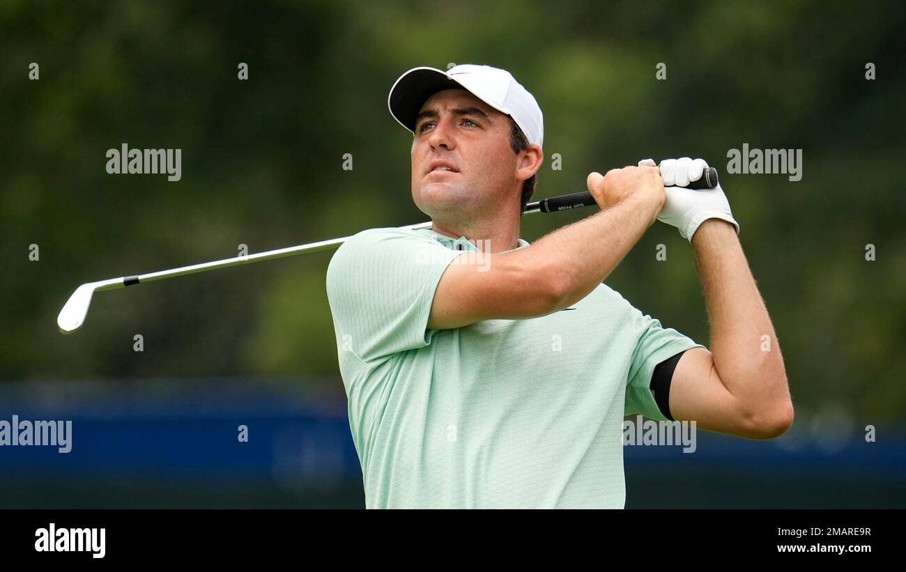 Scottie Scheffler watches his second shot from the 14th fairway during ...