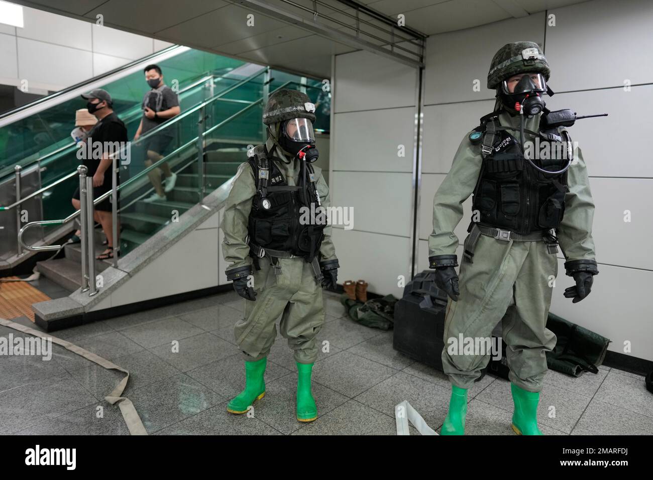 South Korean soldiers wearing anti-chemical gears prepare for a drill ...