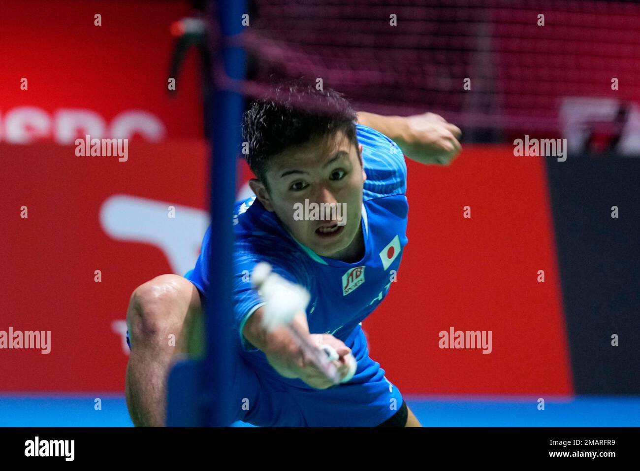 Masayuki Onodera of Japan, with Hiroki Okamura, tries to dig the ...