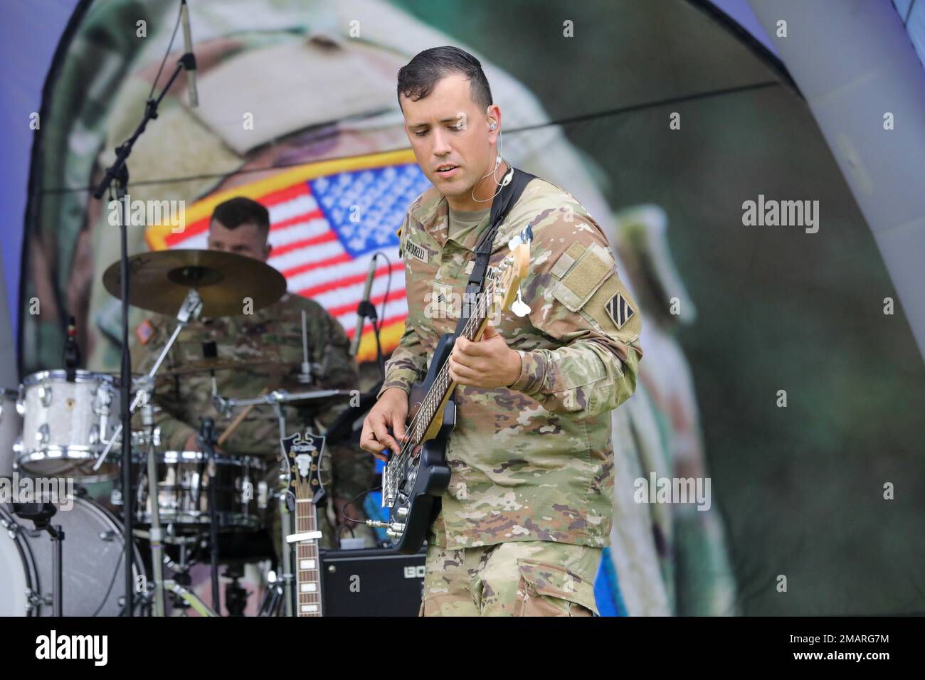 U. S. Army Sgt. Alejandro Bertorelli, a bass guitarist from the 3rd ...