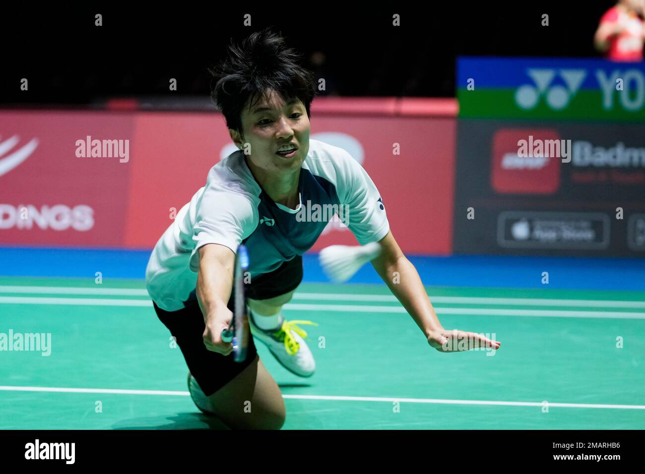 Yip Pui Yin of Hong Kong plays a return during a badminton game of the ...
