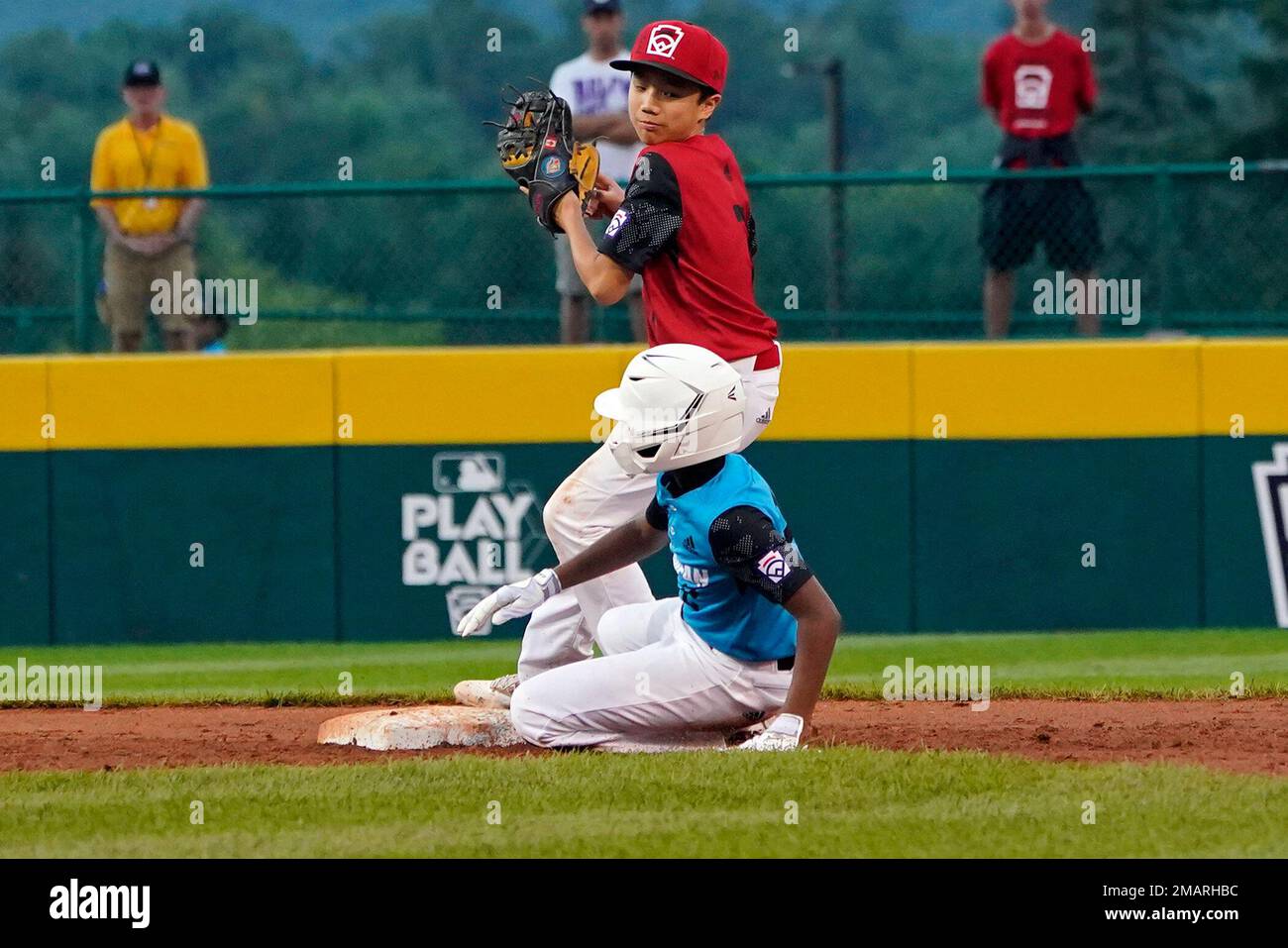 Curacao's Alexander Provacia (2) slides into second and breaks up a ...