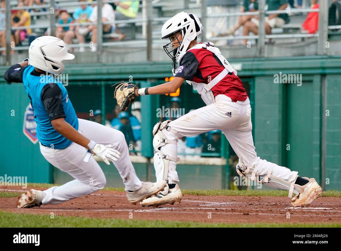 Canada catcher Alden Yu forces out Curacao's Jay-Dlynn Wiel (7) as he ...