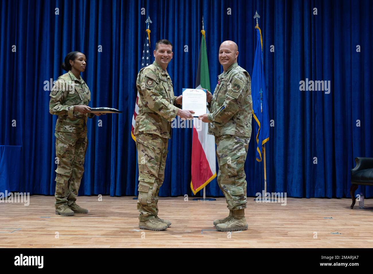 U.S. Air Force Col. Jason R. Barnes, center, commander of the 407th Air ...