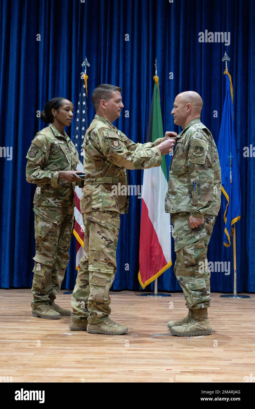 U.S. Air Force Col. Jason R. Barnes, center, commander of the 407th Air ...