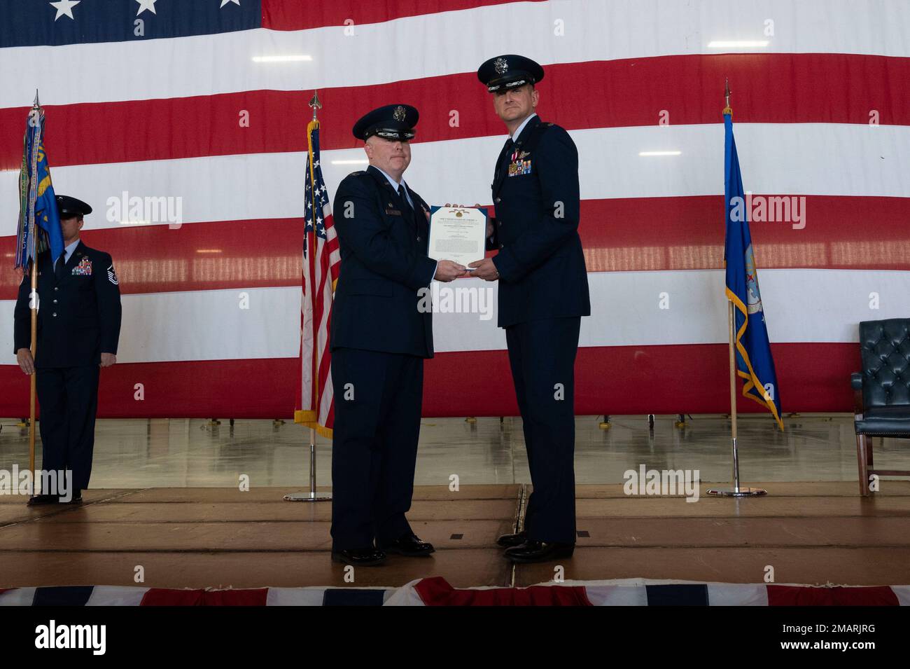 Air Force Col. Adam Bingham, 47th Operations Group commander, presents ...