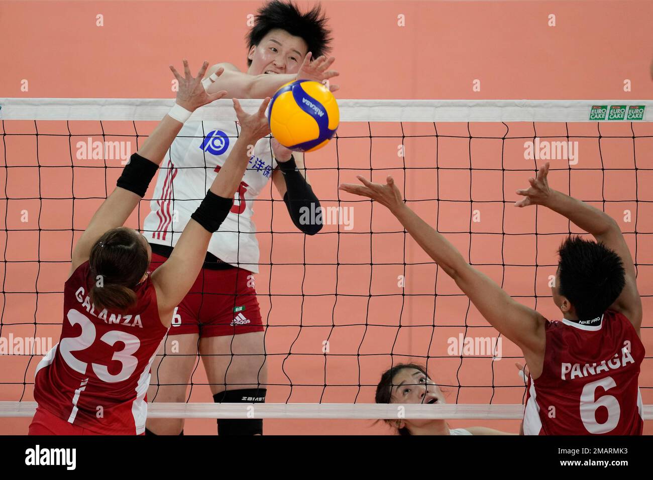 China's Hu Mingyuan hits the ball against Philippines' Jessica Galanza ...