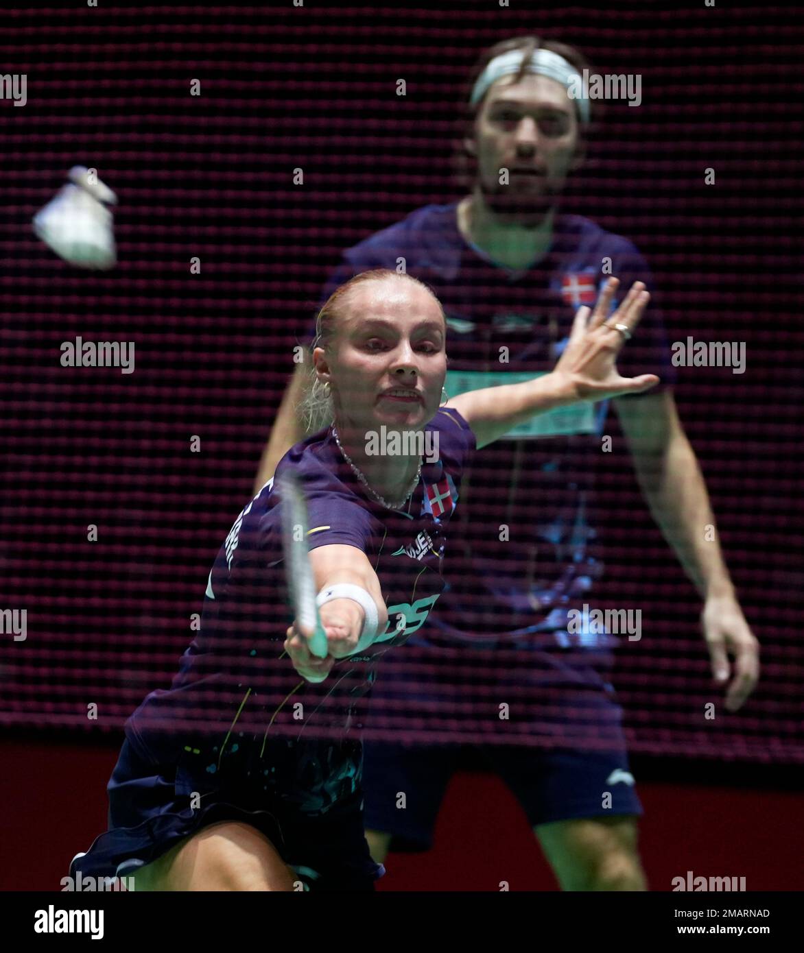 Alexandra Boje of Denmark, with Mathias Christiansen, plays a return ...