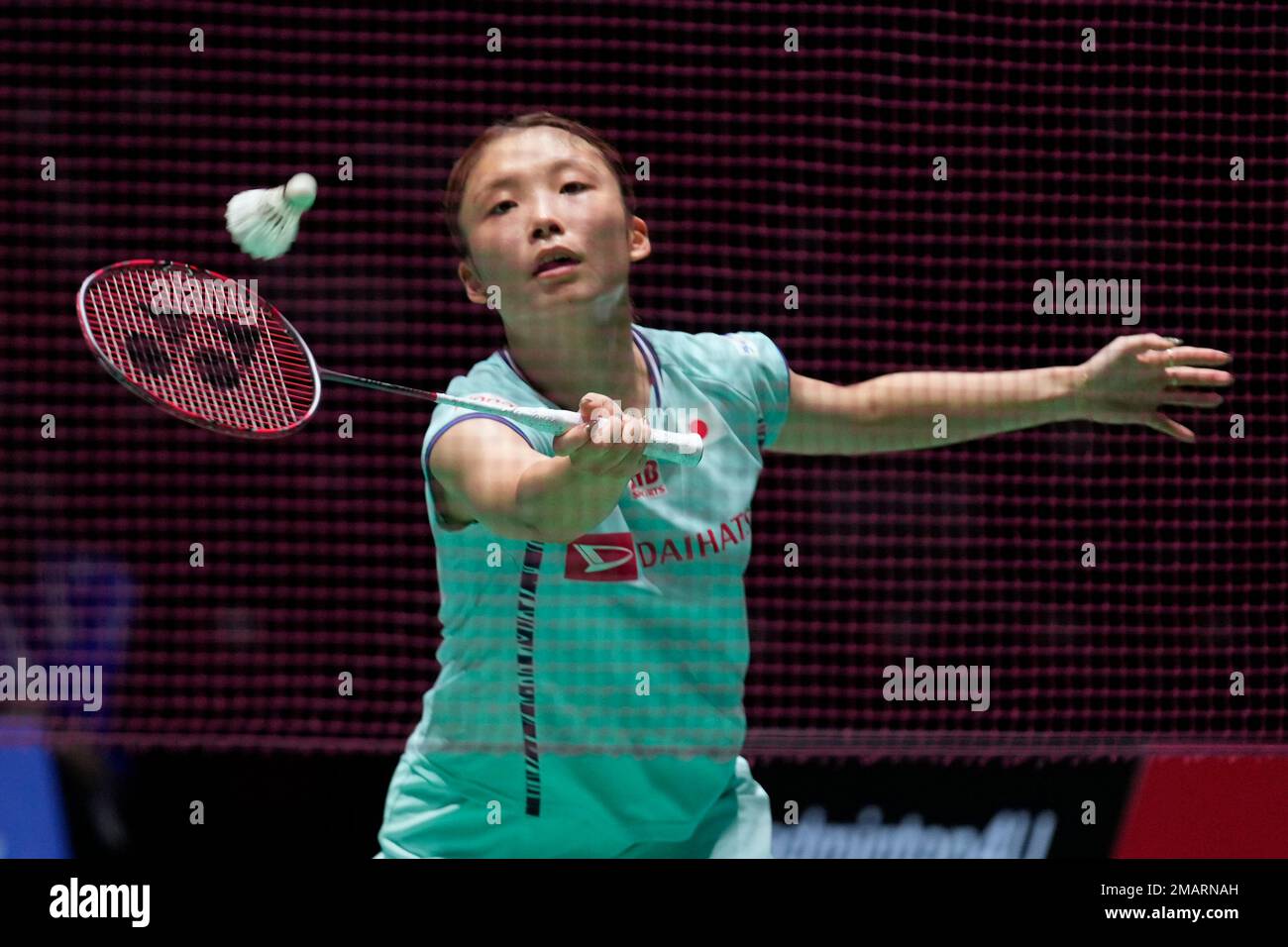 Naru Shinoya of Japan, with Kyohei Yamashita, plays a return during a ...