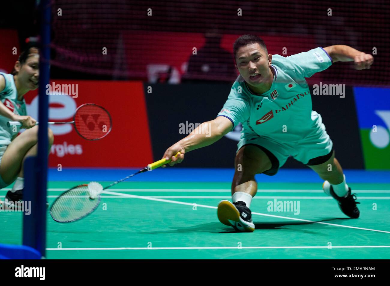 Kyohei Yamashita of Japan, with Naru Shinoya, tries to dig the shuttle ...