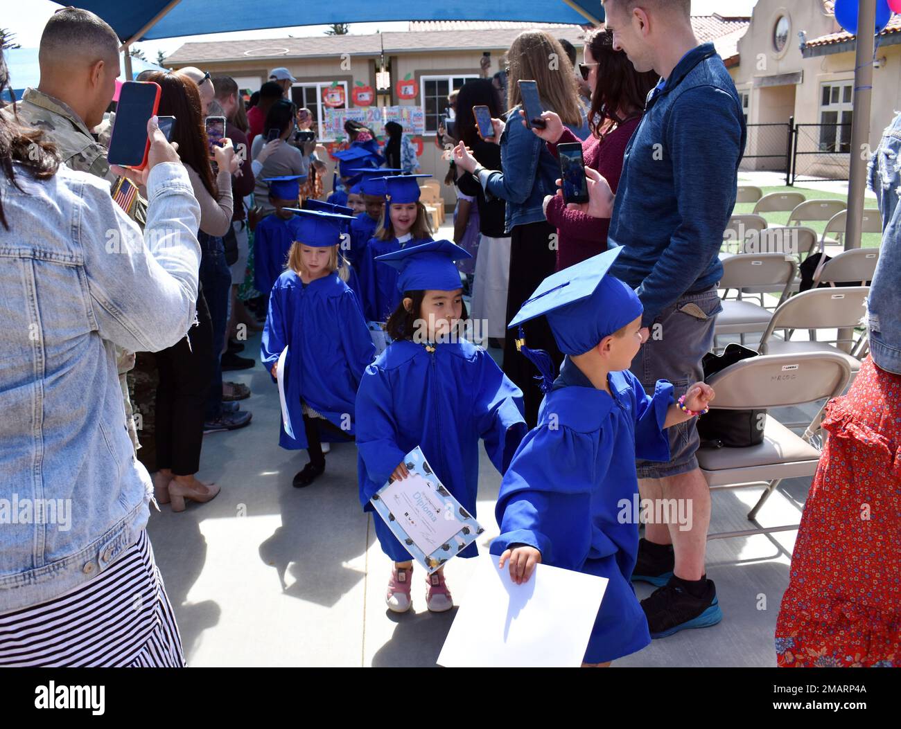 Parents take photos as Strong Beginnings graduates leave their ...