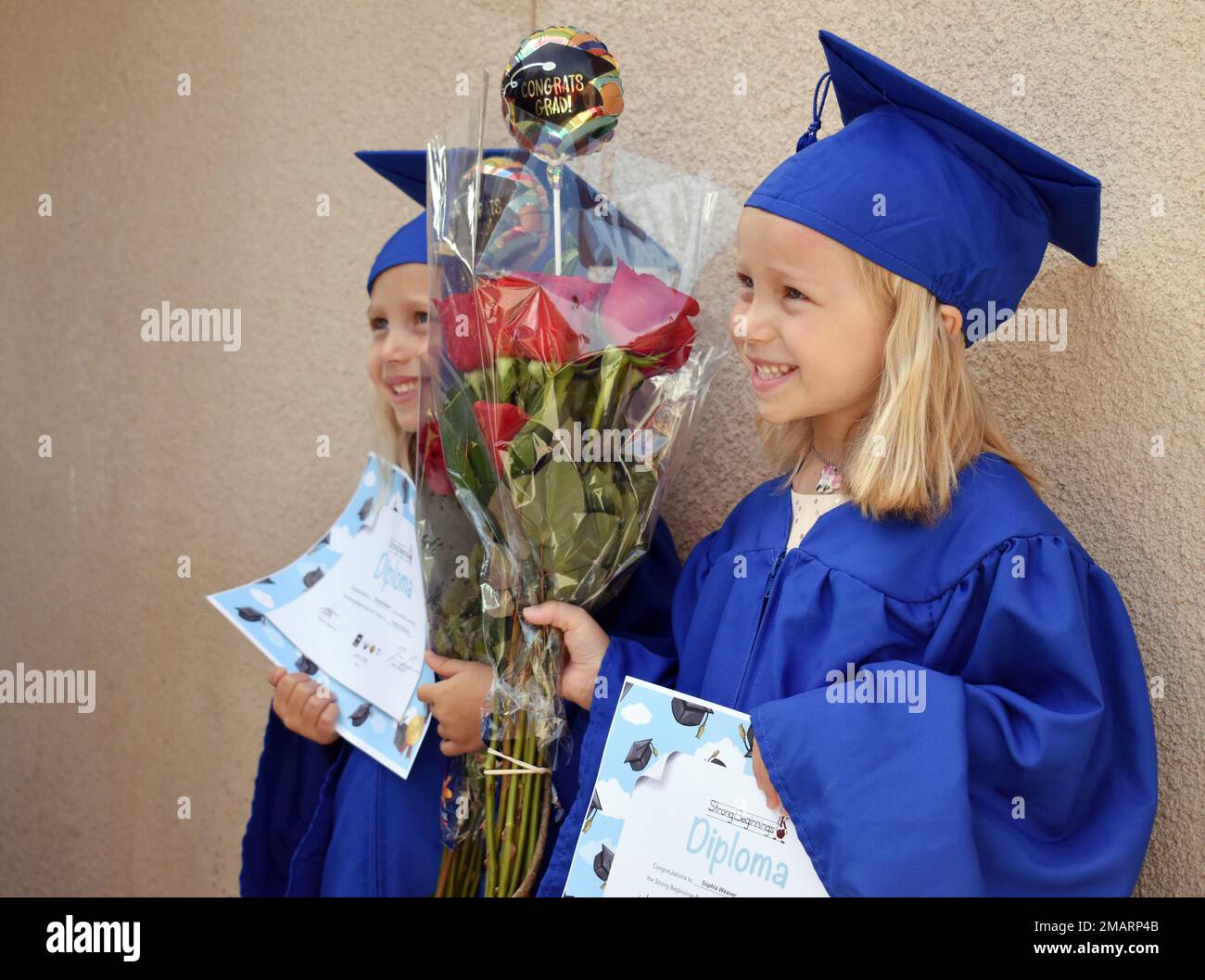 Strong Beginnings graduates pose for photos after the program’s ...