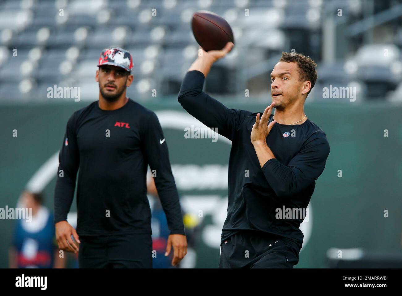 Atlanta Falcons quarterback Desmond Ridder, right, practices alongside ...