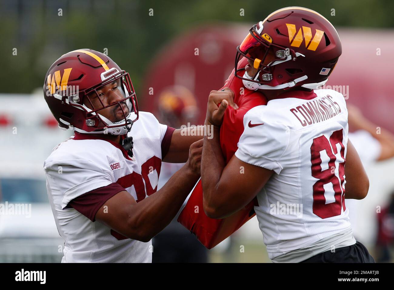 Washington Commanders wide receivers Armani Rogers, left, and Logan ...