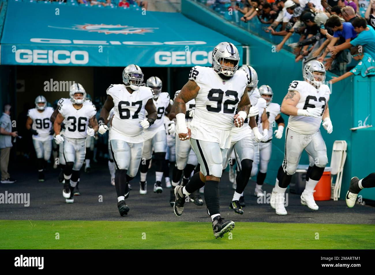 Las Vegas Raiders defensive tackle Kyle Peko (92) runs onto the field ...