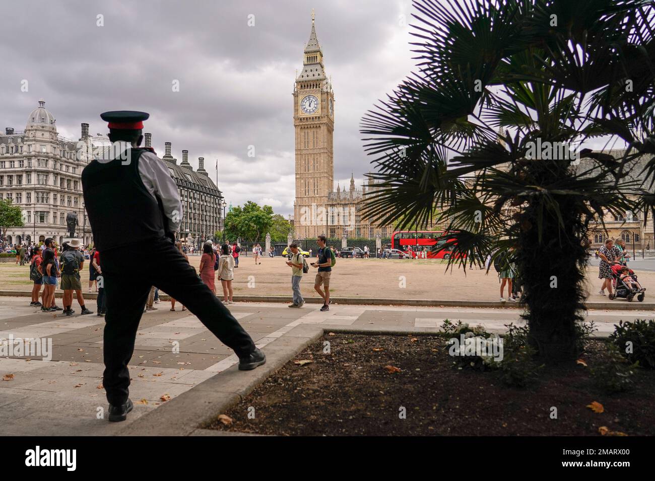 A security guard stands as he patrols Parliament Square, in London ...