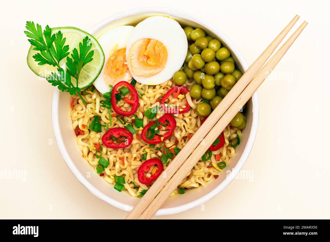Beautiful Noodle Dish with Green Pea, Eggs, Red Hot Pepper and Greens ...