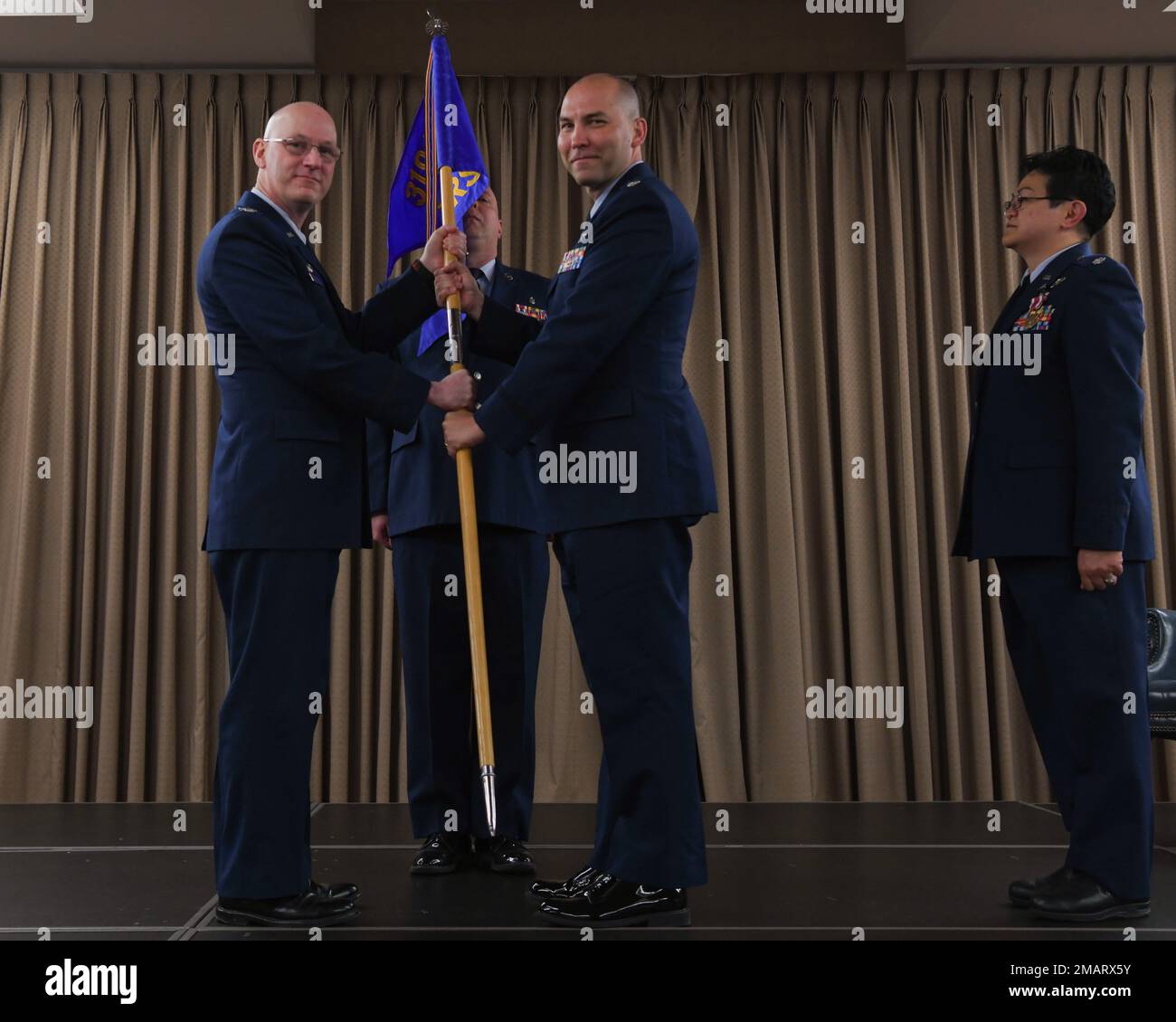 U.S. Air Force Col. Jason Musser, 319th Medical Group commander, passes ...