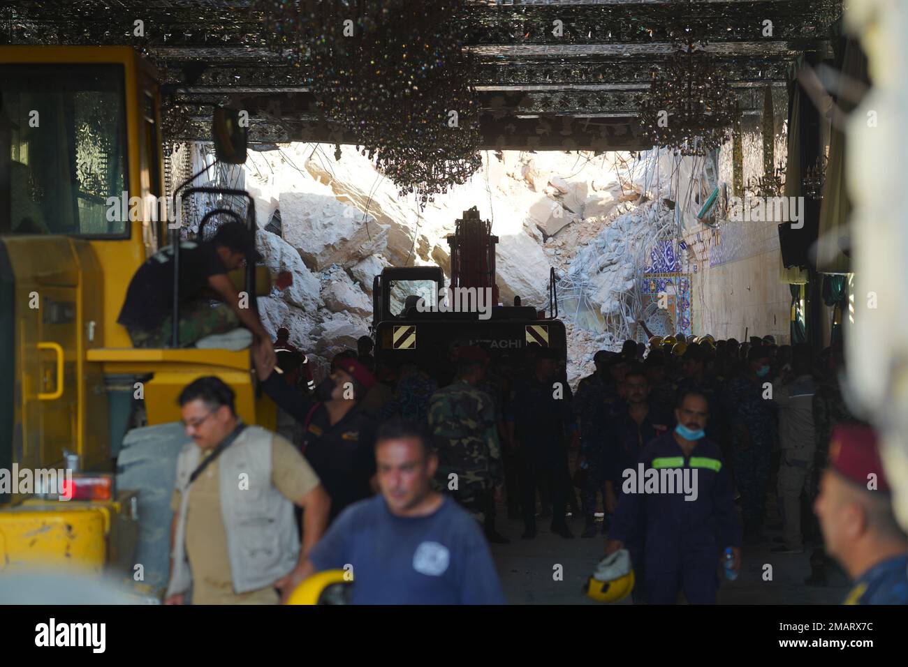 Emergency services and rescue workers are seen at Qattarat al-Imam Ali ...