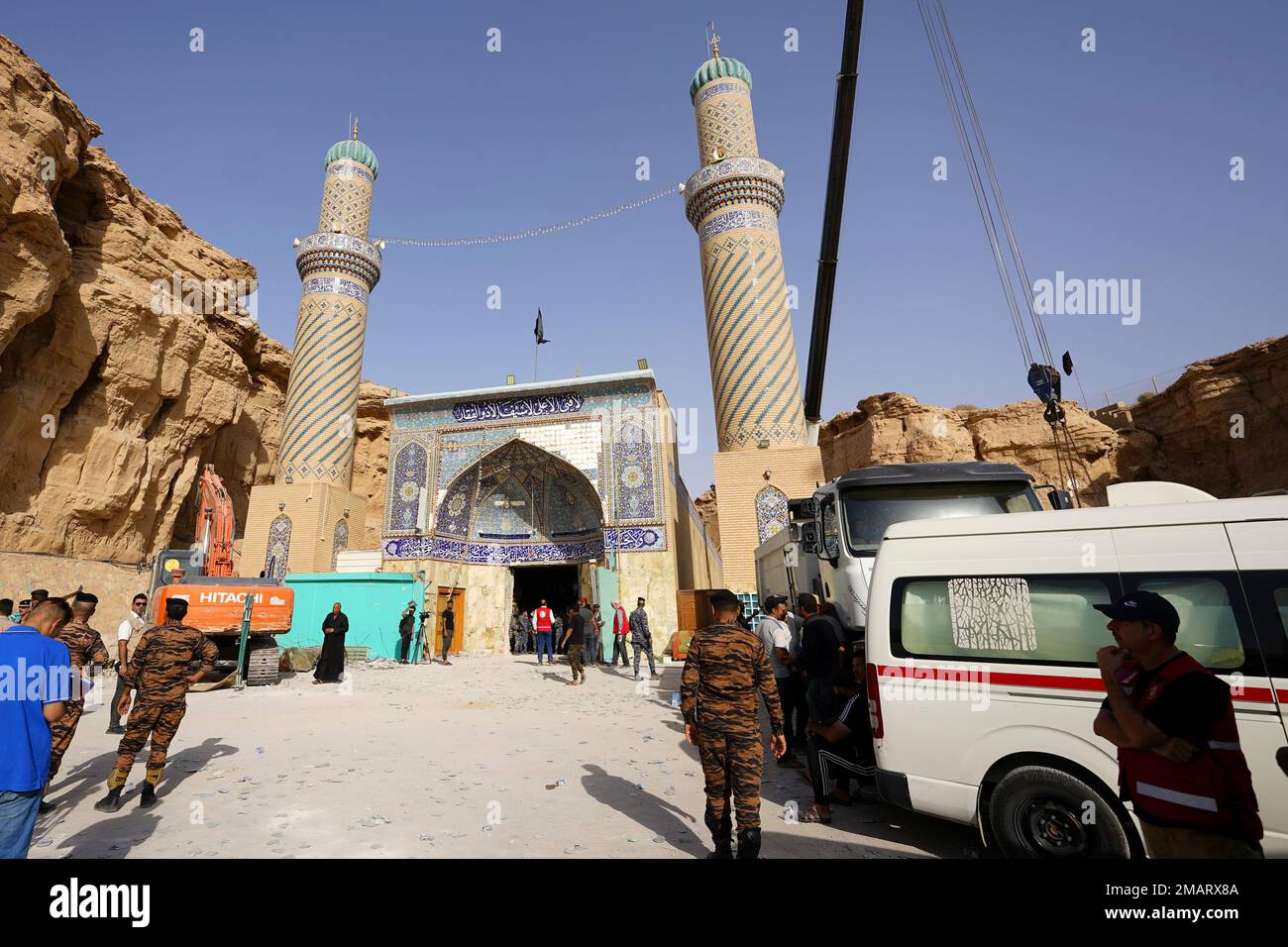 Emergency services and rescue workers are seen at Qattarat al-Imam Ali ...