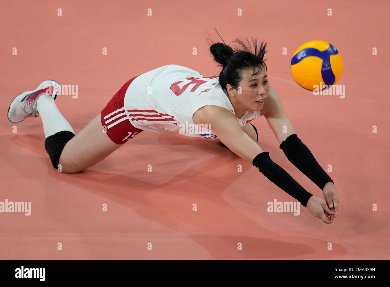 China's Xu Jianan returns a shot during their preliminary match against ...
