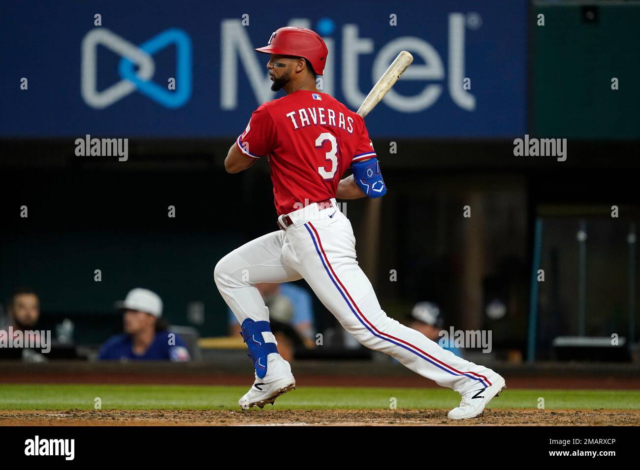 Texas Rangers' Leody Taveras follows through on a swing during a ...