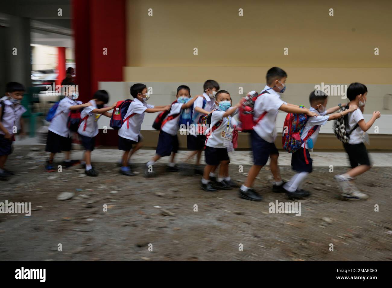 Students fall in line during the opening of classes at the San Juan ...