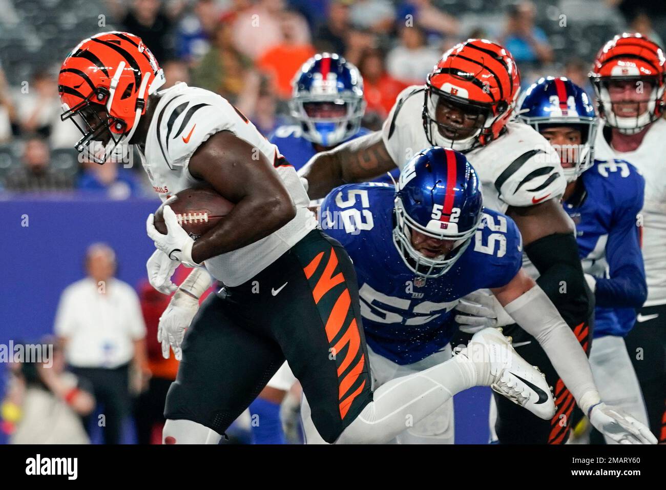 Cincinnati Bengals' Jacques Patrick, left, rushes past New York Giants ...