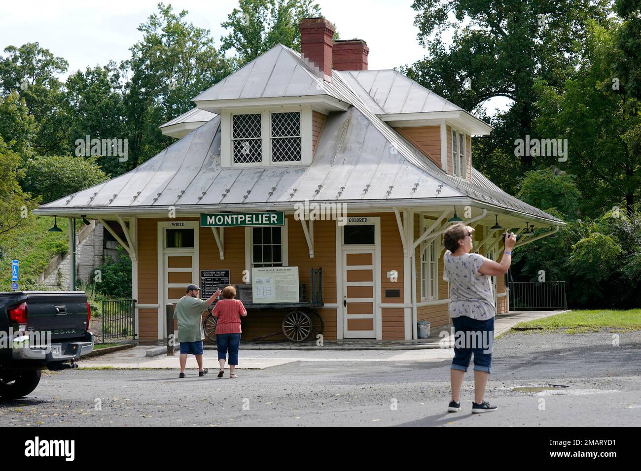Visitors stand outside the Montpelier Station Post Office on Sunday ...