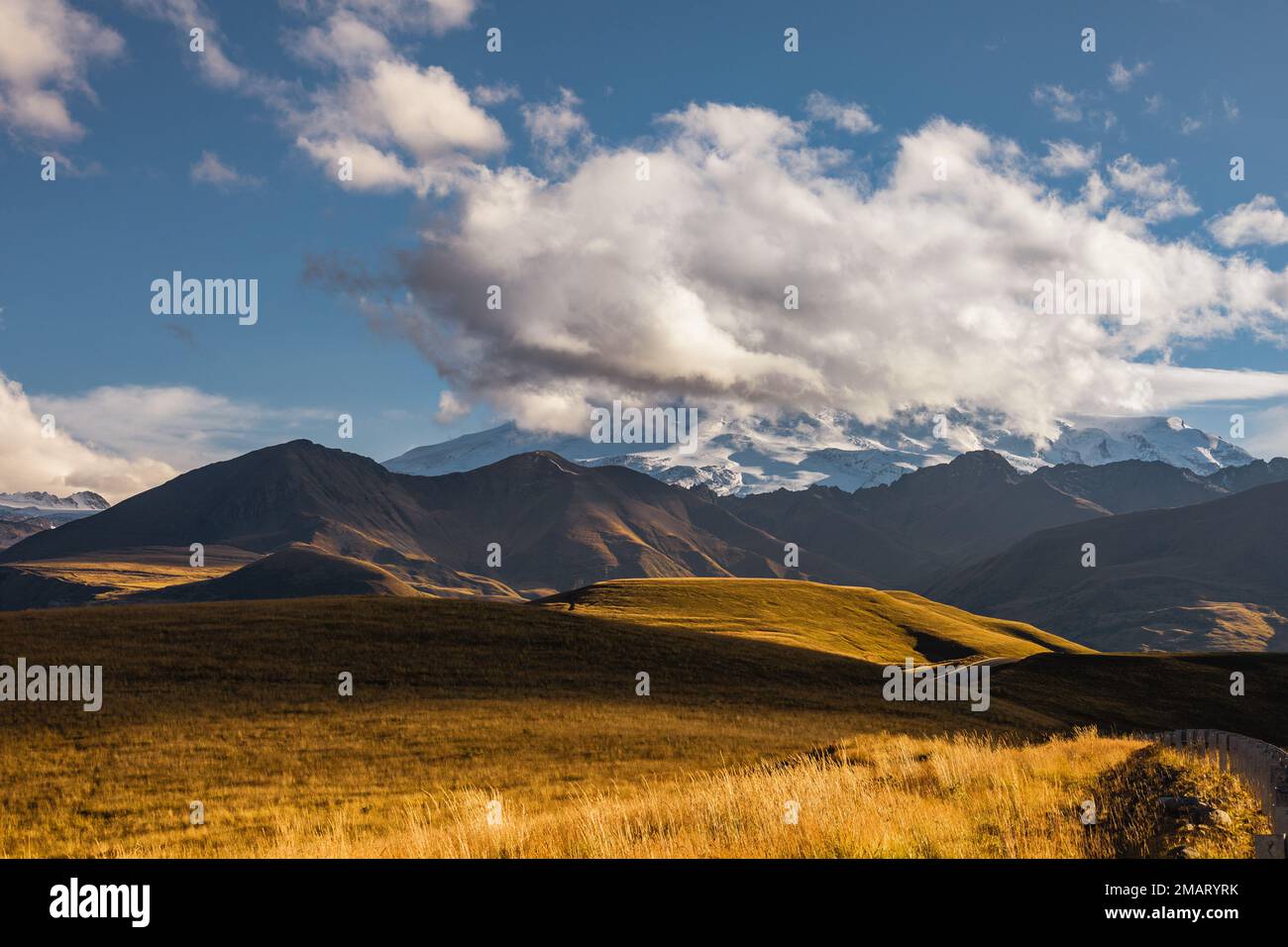 Big mountain Elbrus against the blue sky. View from a large plateau and ...