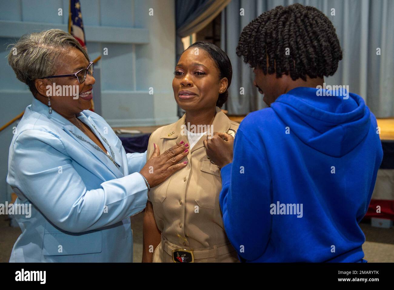 Master Chief Navy Counselor Tanasha Fabian is pinned by her son Trevon ...