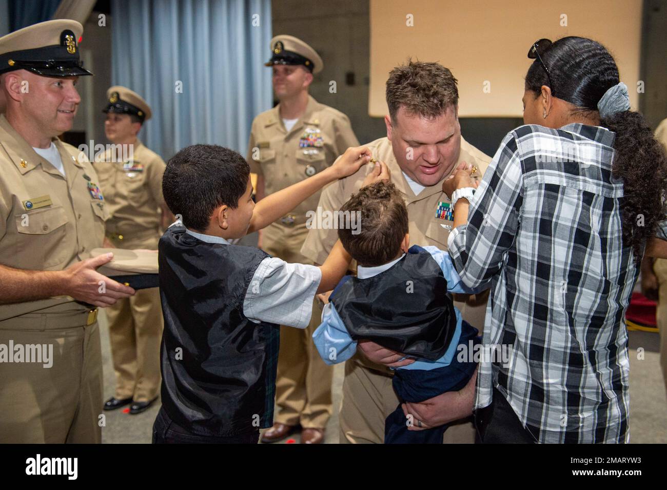 Senior Chief Hull Maintenance Technician Chris Laprete is pinned by his ...