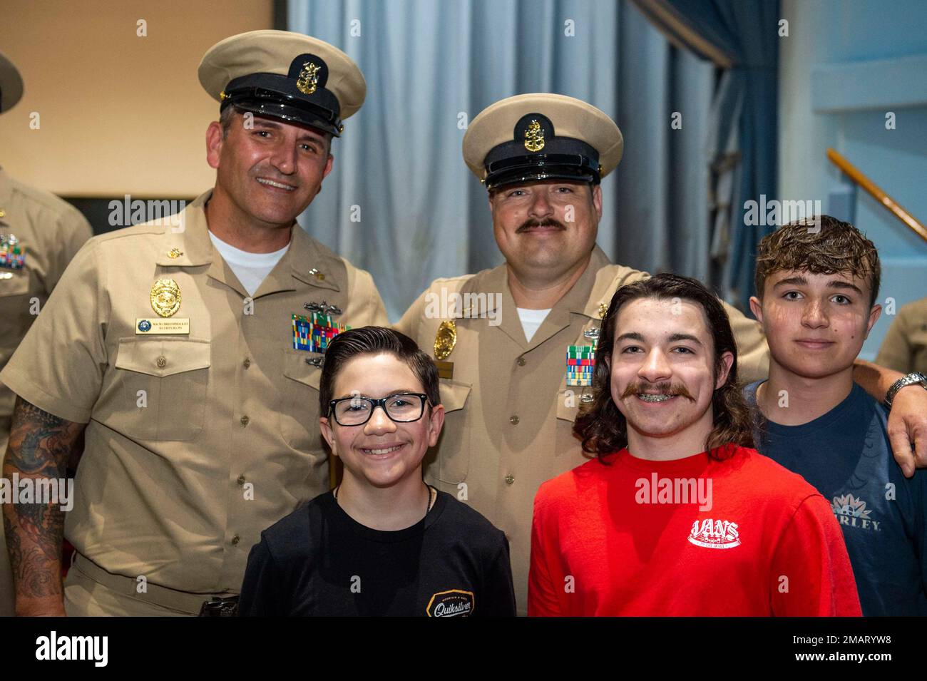 Senior Chief Master-at-Arms Tony Vuono was pinned by his sons Avery ...
