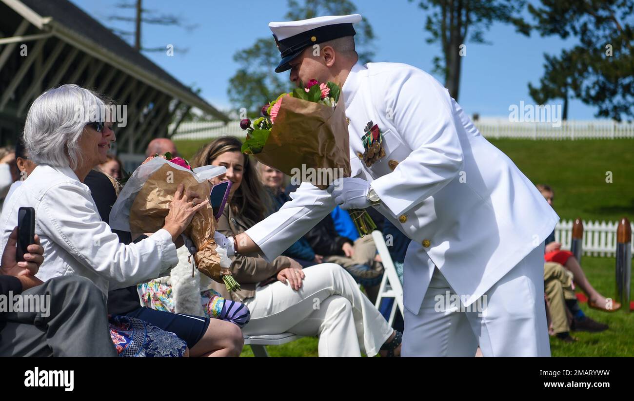 Cmdr. Sean Gray's family is given flowers from the crew as he is ...