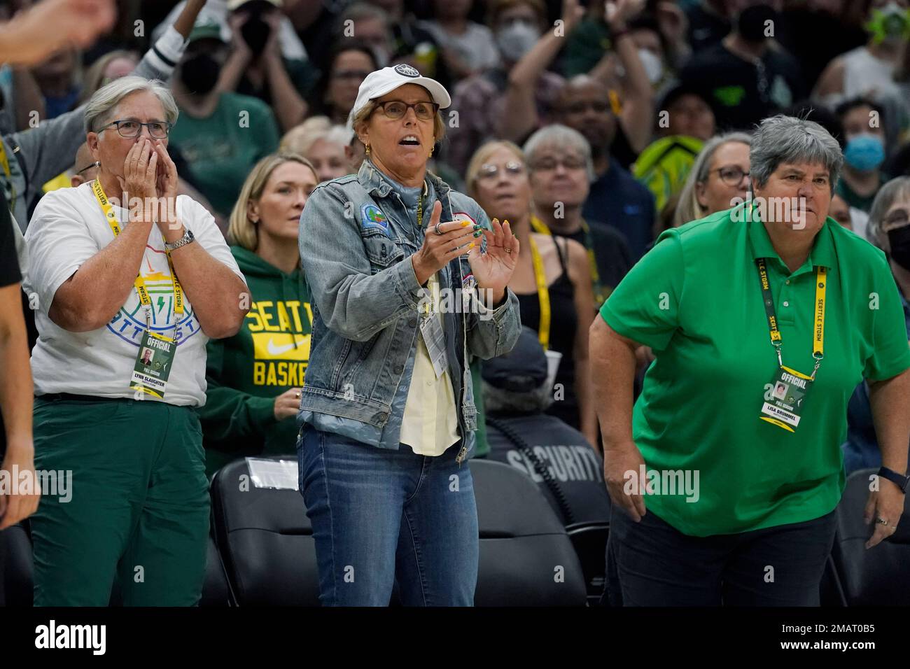 Seattle Storm owner Ginny Gilder, center, cheers with her wife, Lynn ...