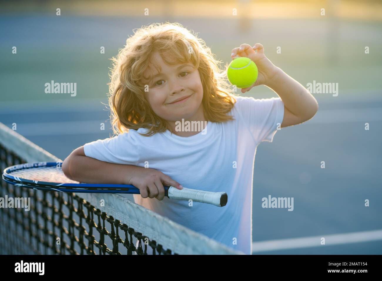 Tennis child. Kid with tennis racket and tennis ball playing on tennis ...