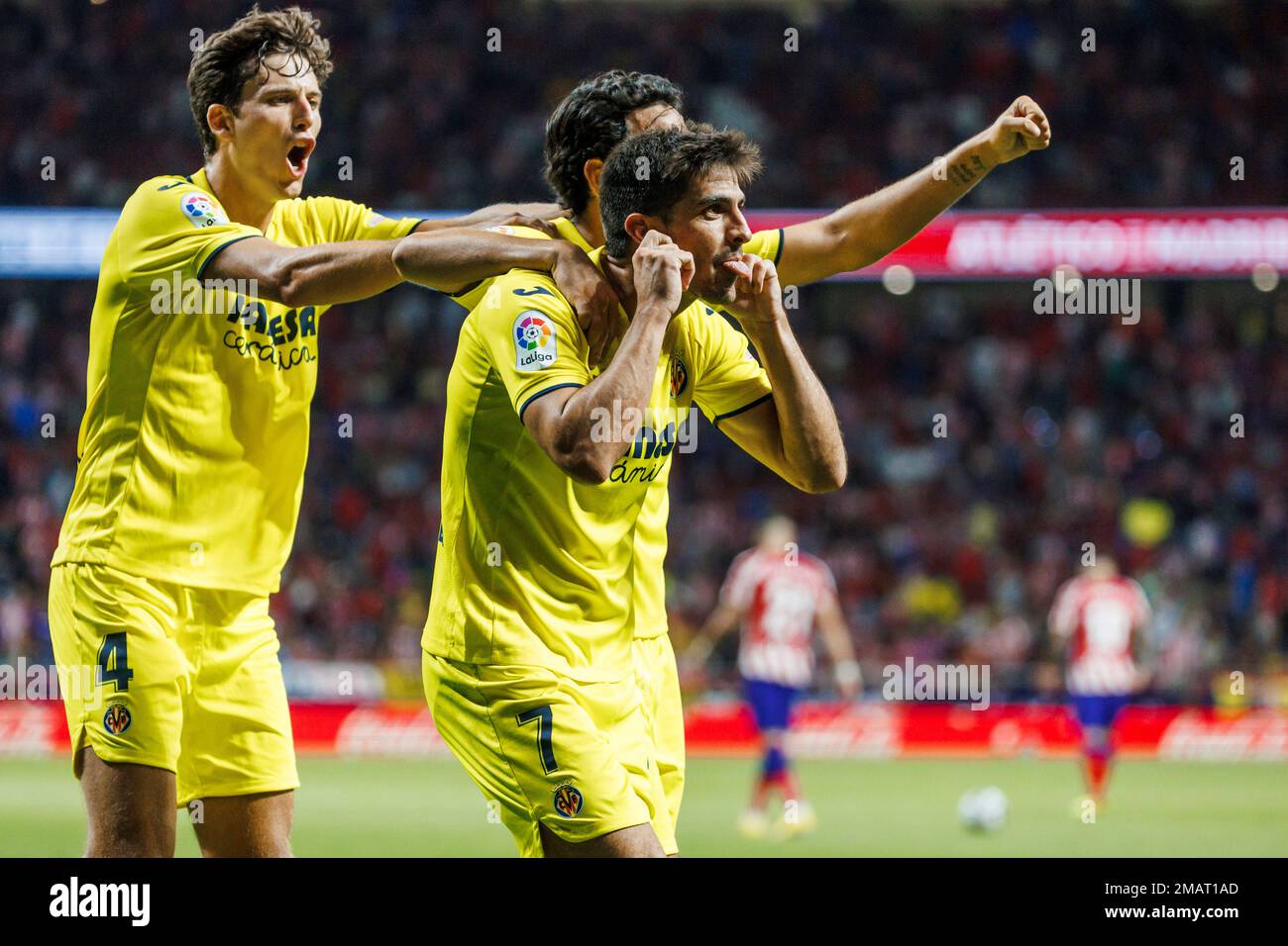 Villarreal's Gerard Moreno, right, celebrates sticking his tongue out ...