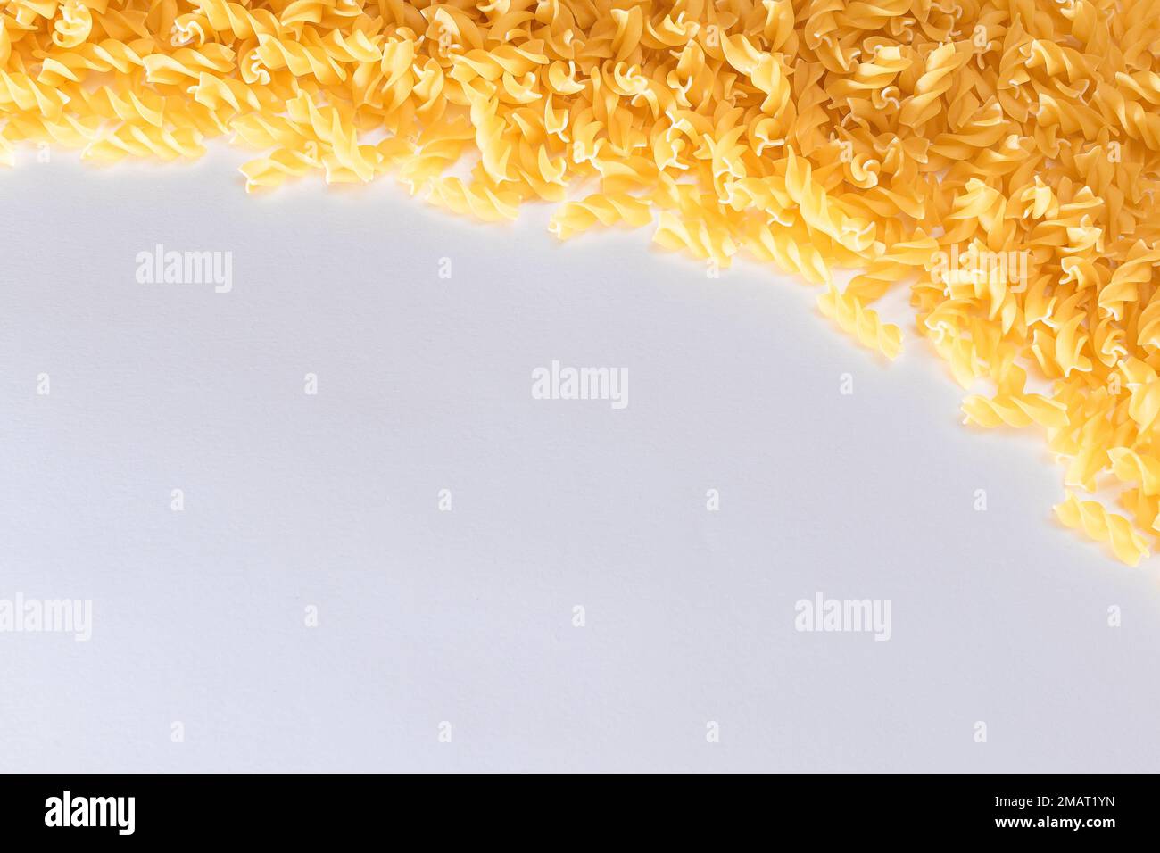 Uncooked Fusilli Pasta with Copy Space on White Background. Raw and Dry ...