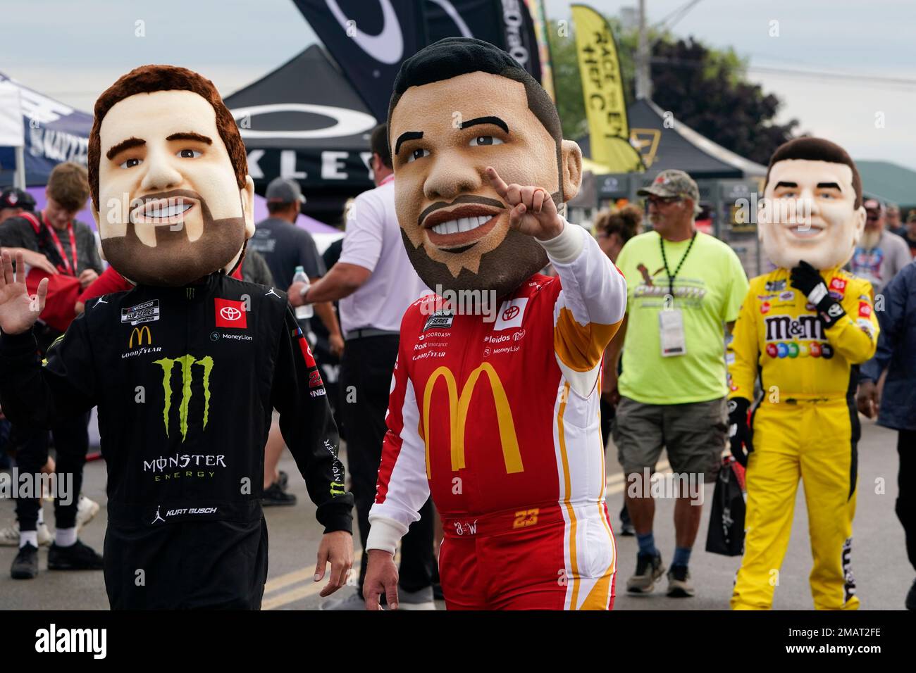 Caricatures of race car drivers greet fans before a NASCAR Cup Series ...