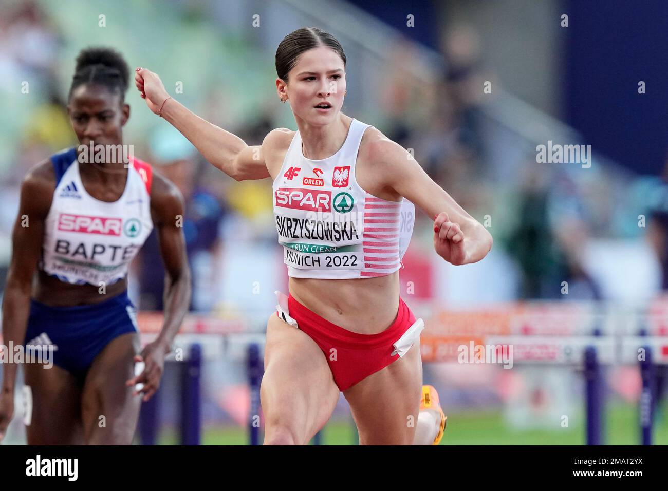 Pia Skrzyszowska, of Poland, wins her Women's 100 meters hurdles ...