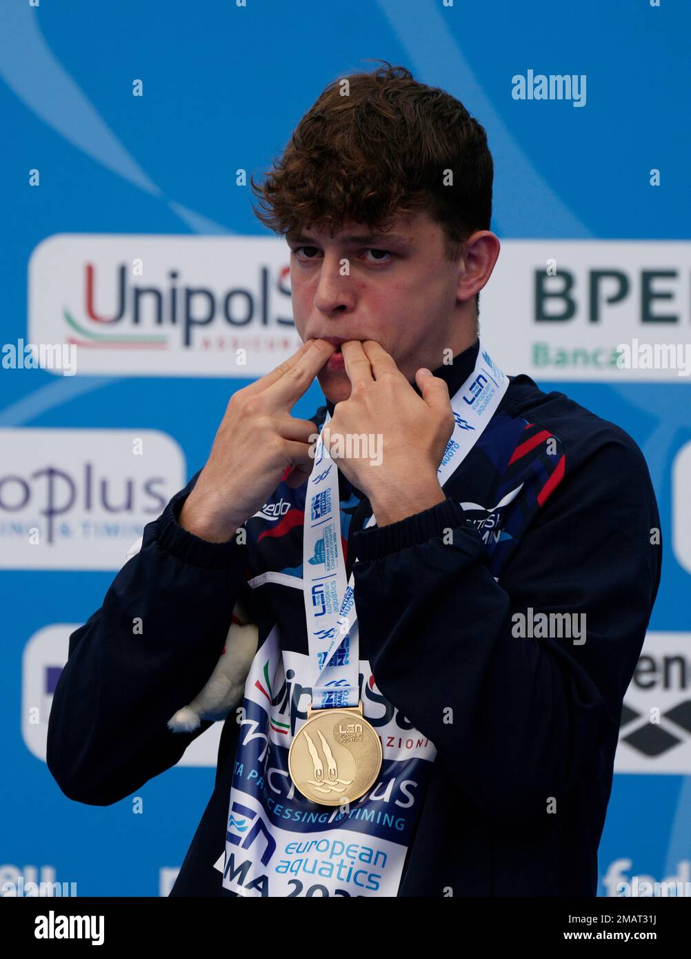 Ben Cutmore of Britain celebrates his bronze medal on the podium of the ...