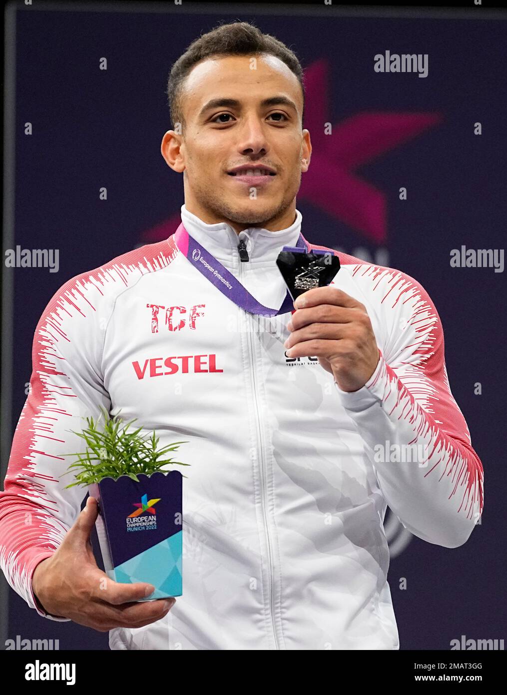 Silver medalist Turkey's Adem Asil poses with his medal in the men's ...