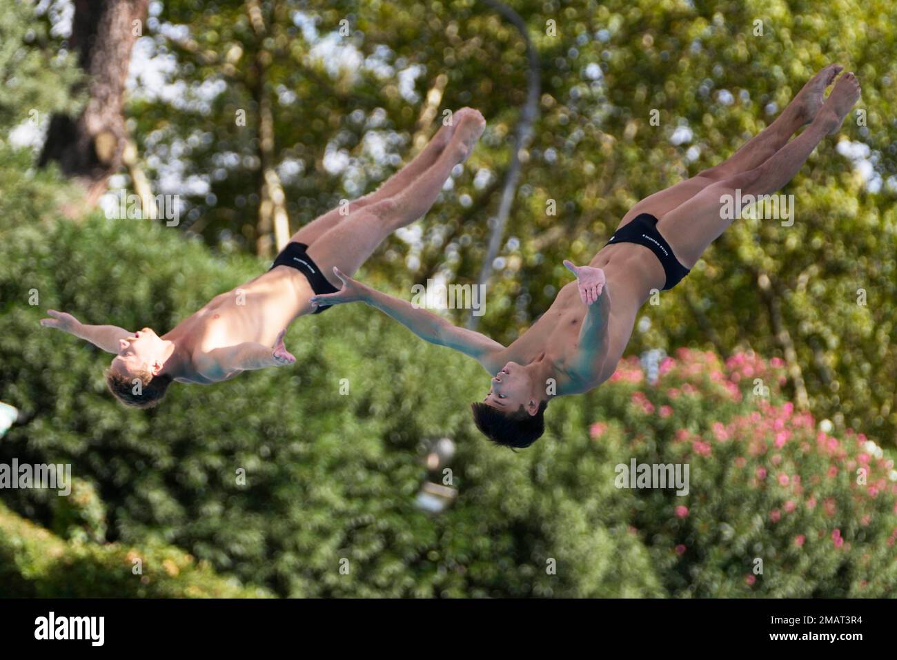 Guillame Dutoit and Jonathan Suckov of Switzerland dive during ...